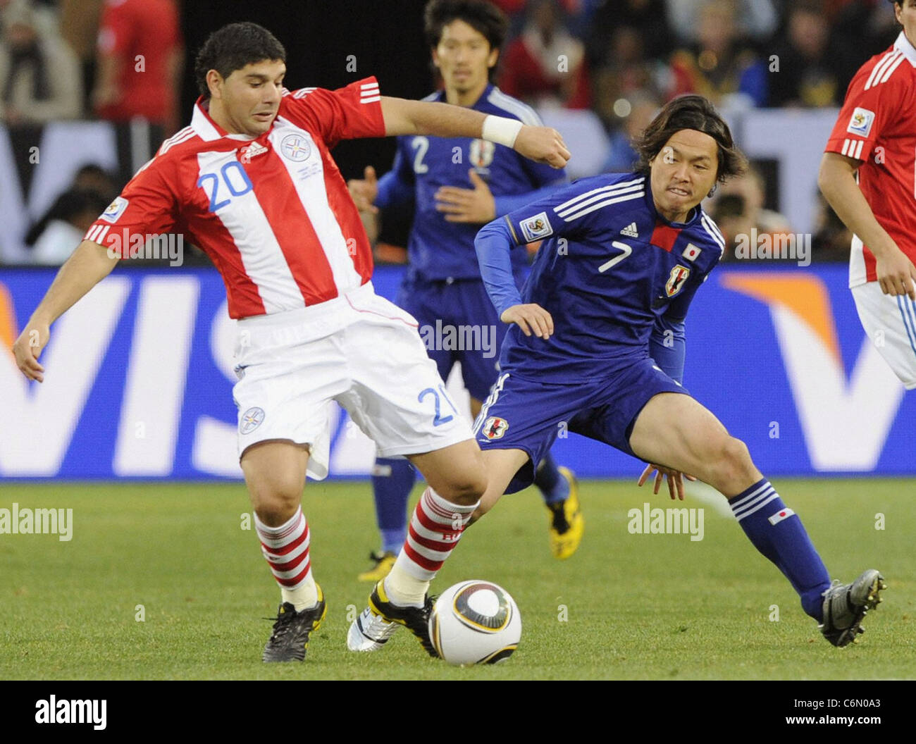 Japan midfielder Yasuhito Endo (R) and Paraguay midfielder Nestor ...