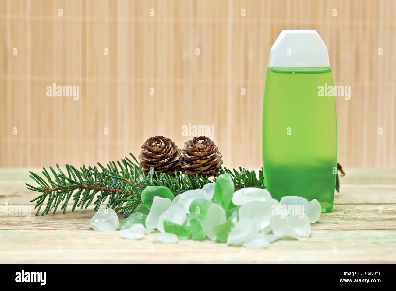 Coniferous extract bath with a sprig of pine needles, pine cones and ...