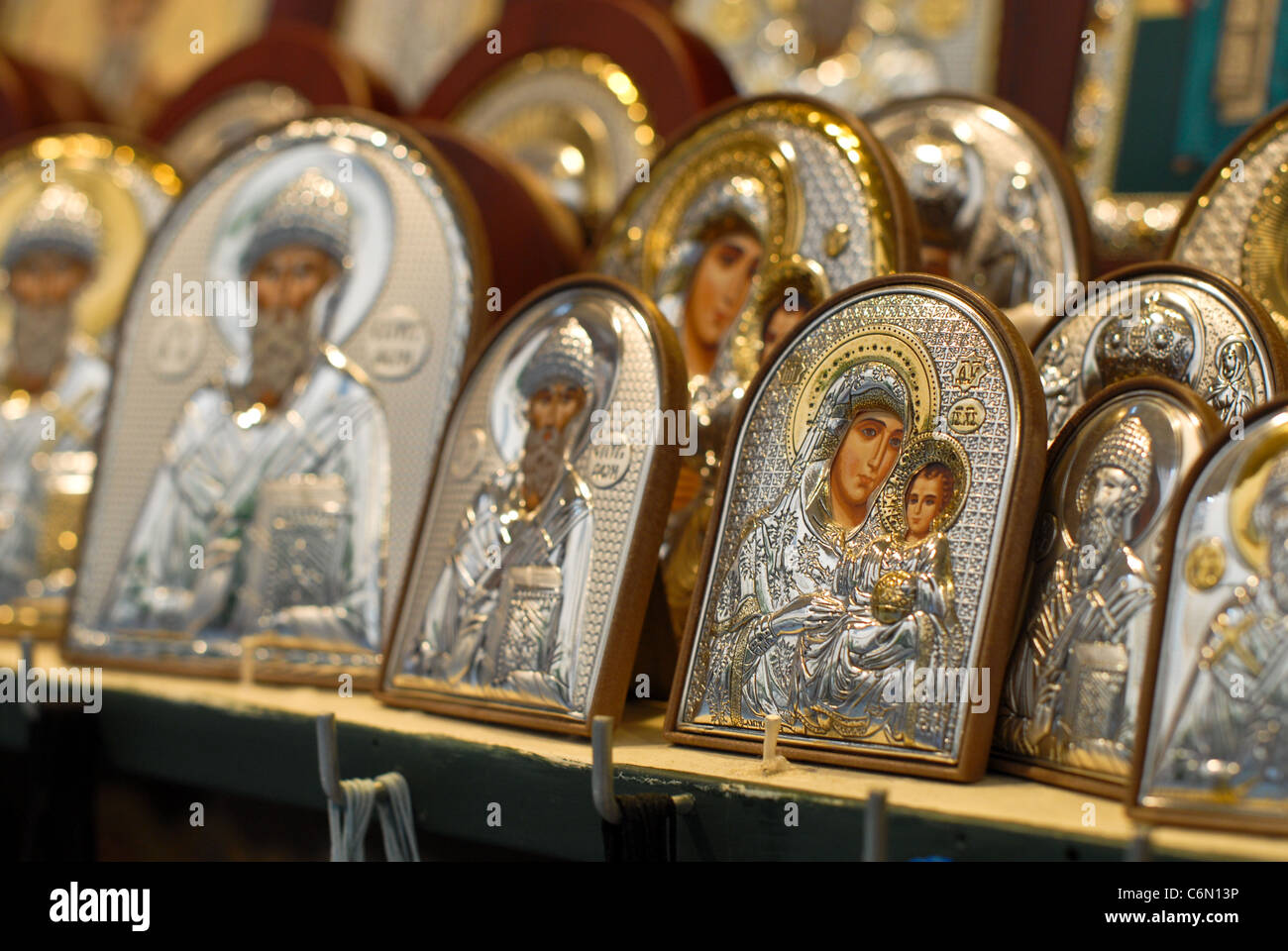 Rows of ornate holy Greek religious icons with saints and religious ...