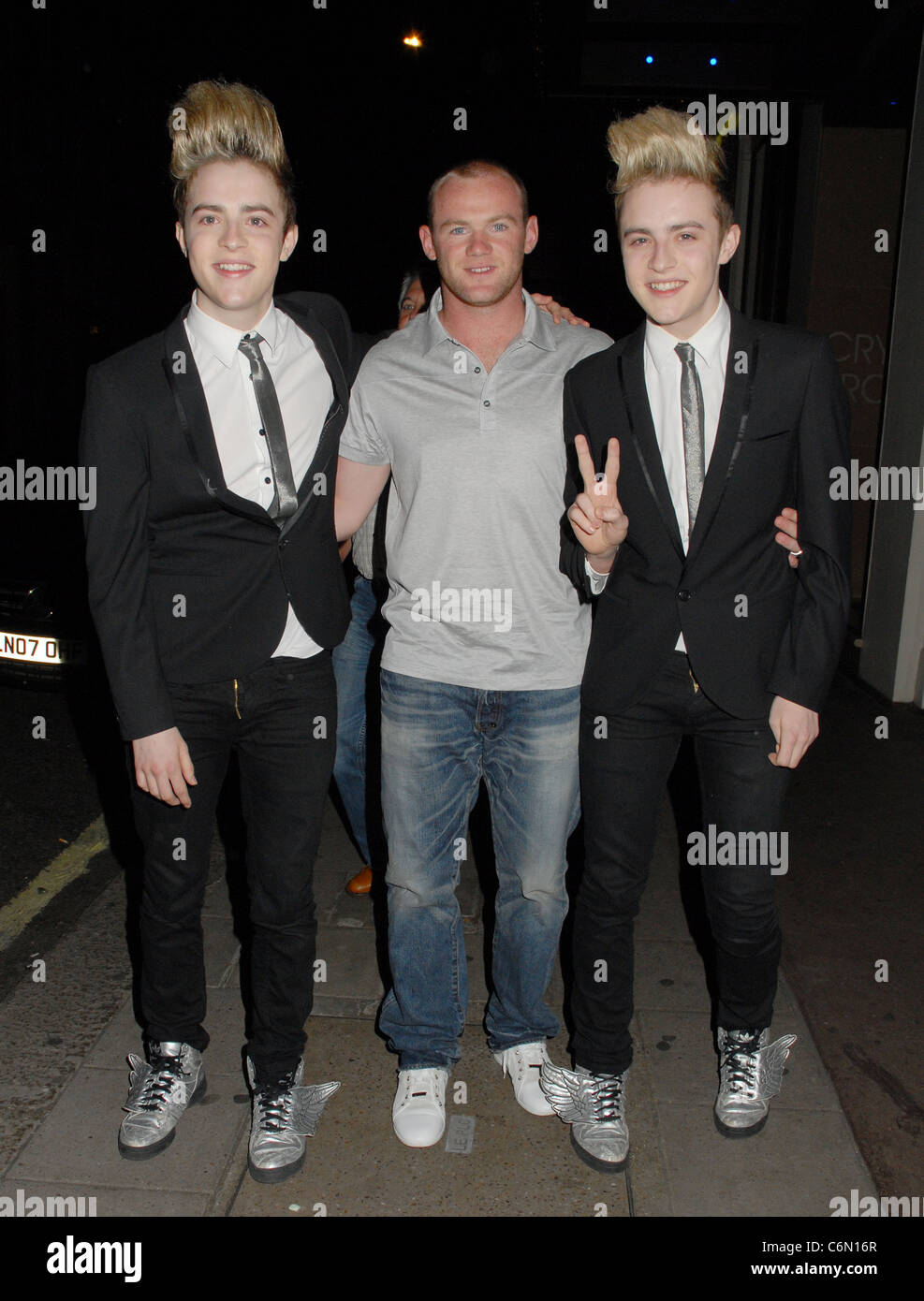 Wayne Rooney with John Grimes and Edward Grimes aka Jedward, leaving ...