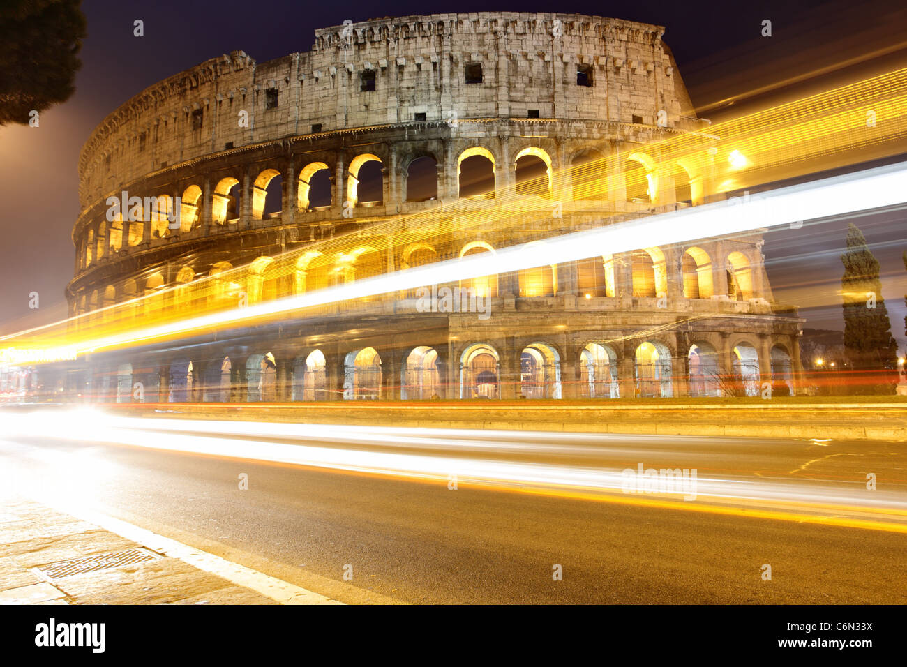 The Colosseum at night and traffic lights, Rome, Italy Stock Photo - Alamy