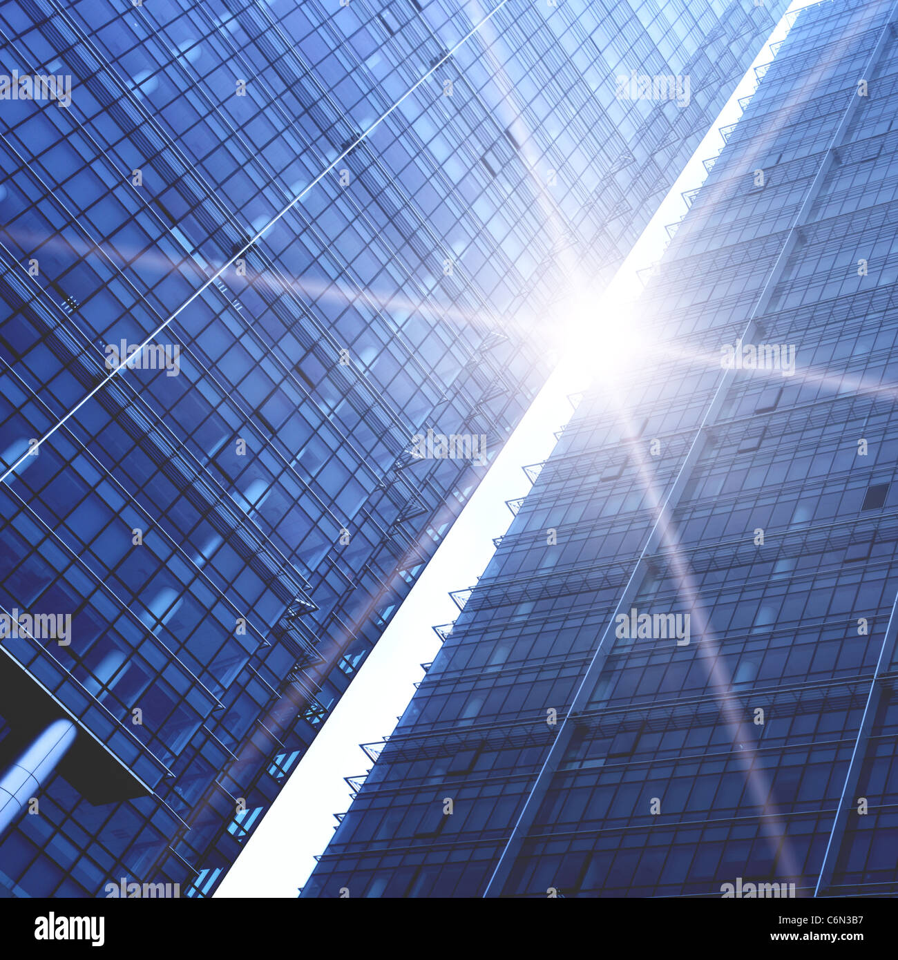 Two abstract skyscrapers with sun glare Stock Photo - Alamy