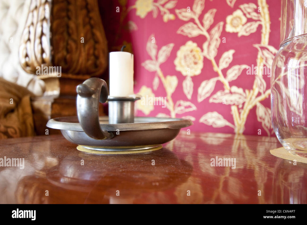 old style candle in candle holder on table Stock Photo - Alamy