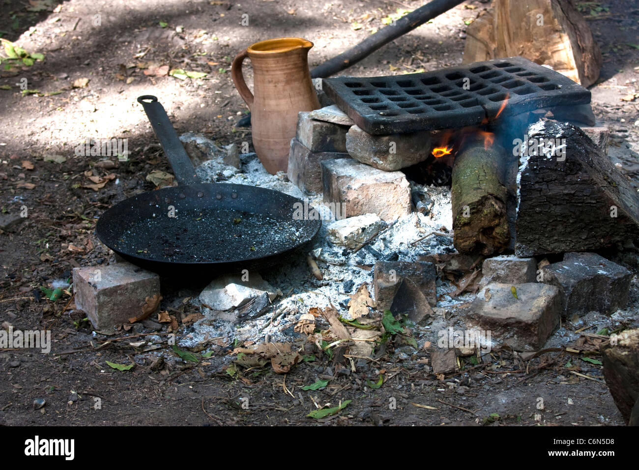 cooking on a fire outside in the woods Stock Photo - Alamy