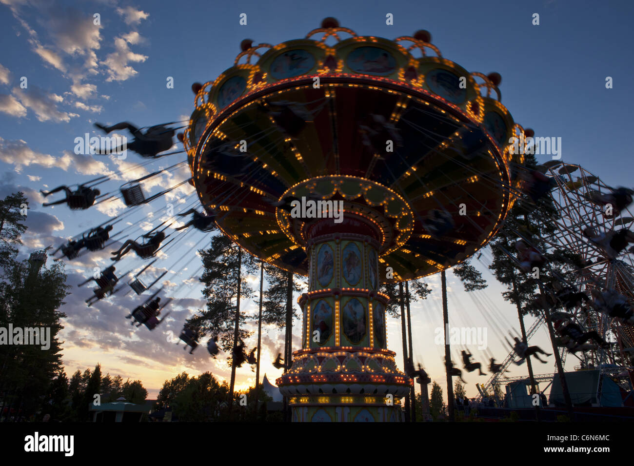 Vintage merry-go-round at the sunset, motion blur shot Stock Photo - Alamy