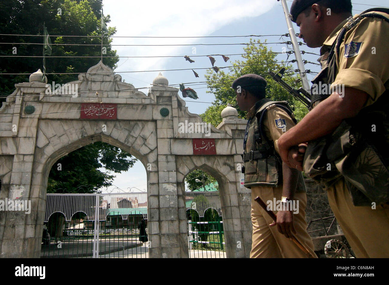 Indian paramilitary soldiers stand guard outside Martyr's Graveyard in ...