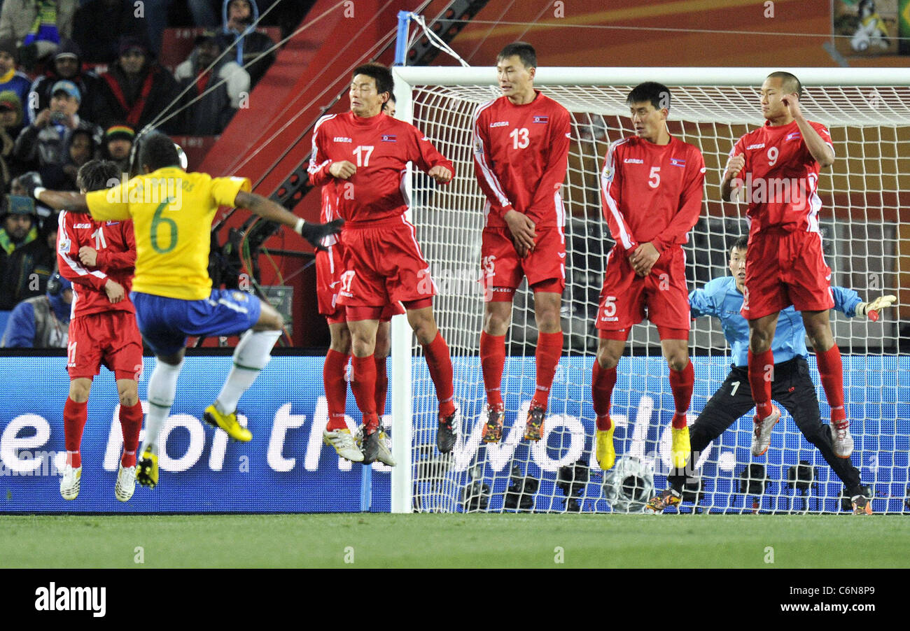 North Korean players defend a free kick from Brazilian defender Michel ...