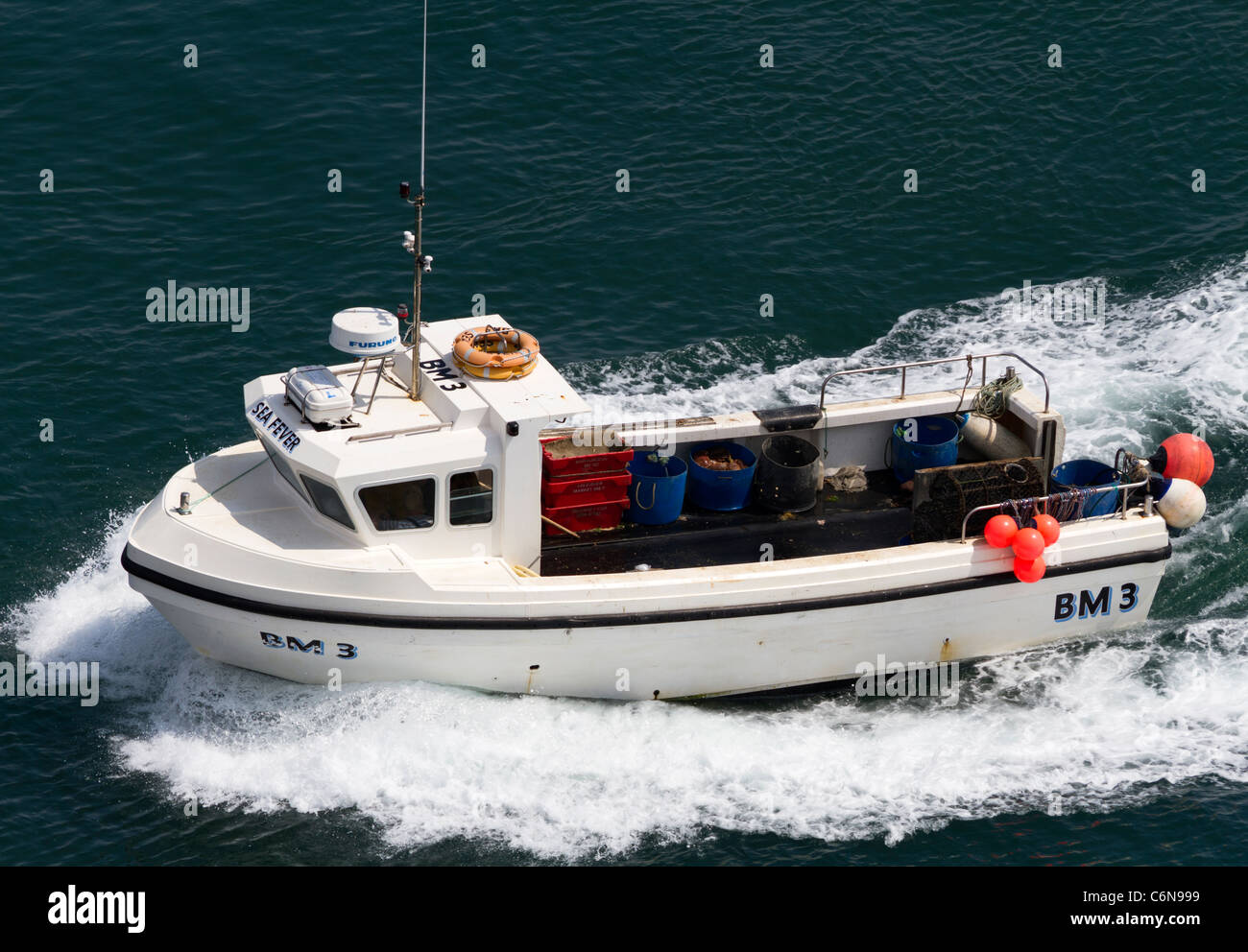 Fishing boat returning to port with its catch of crabs Stock Photo - Alamy