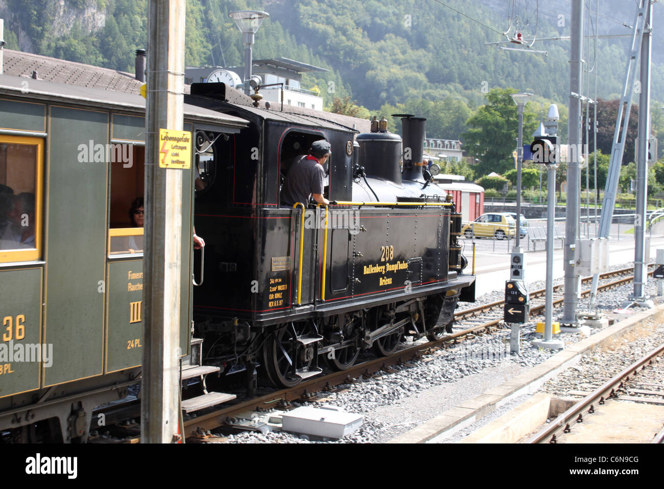 Preserved steam engine with a special train at Meiringen in Switzerland ...