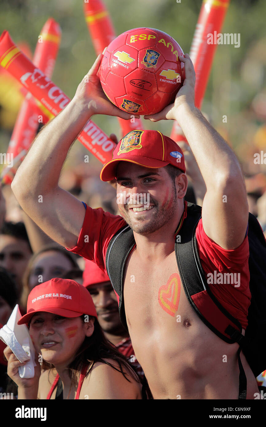 Crowds cheer for the Spanish team as they travel in an open bus as part ...