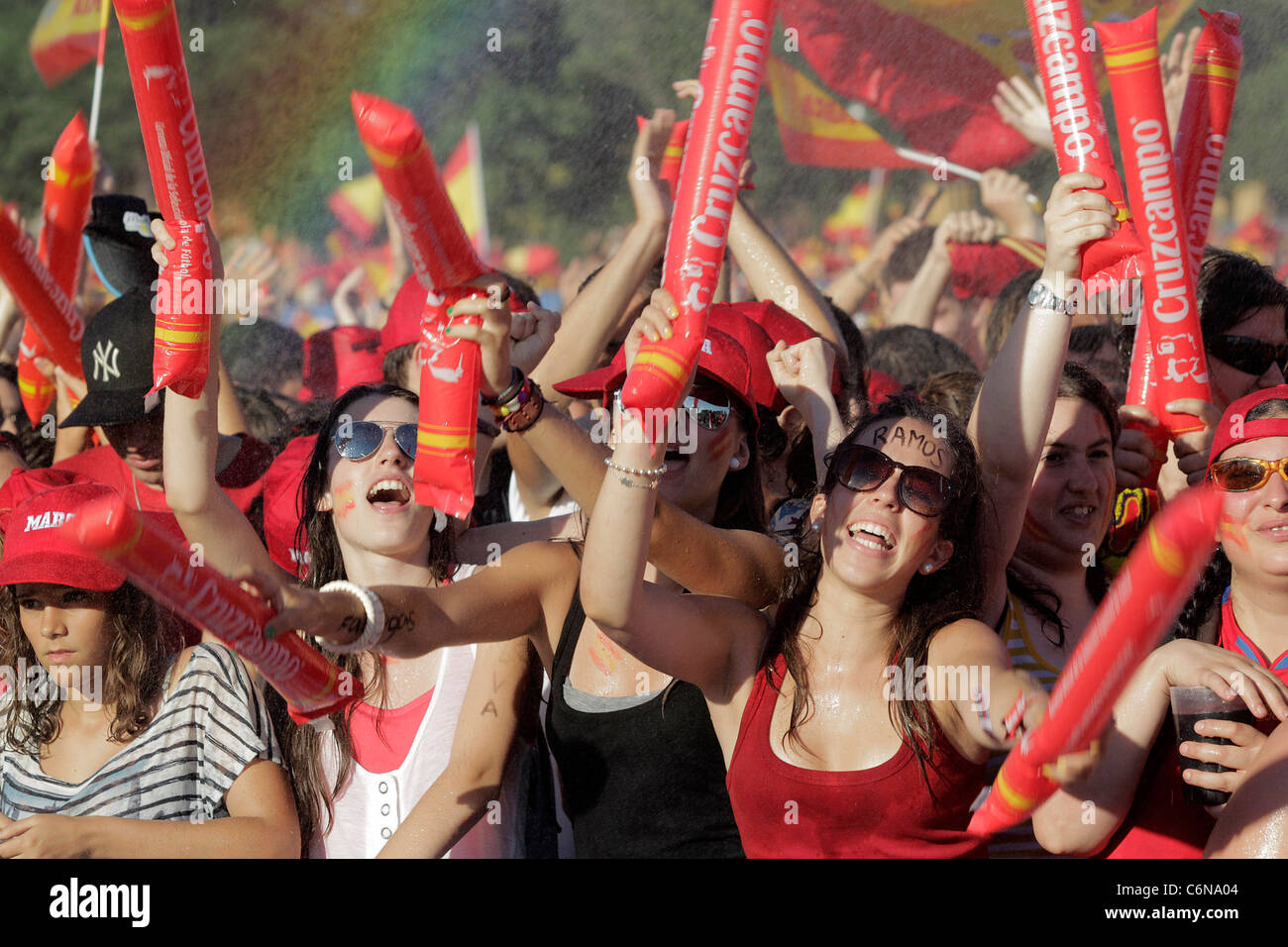 Crowds cheer for the Spanish team as they travel in an open bus as part ...
