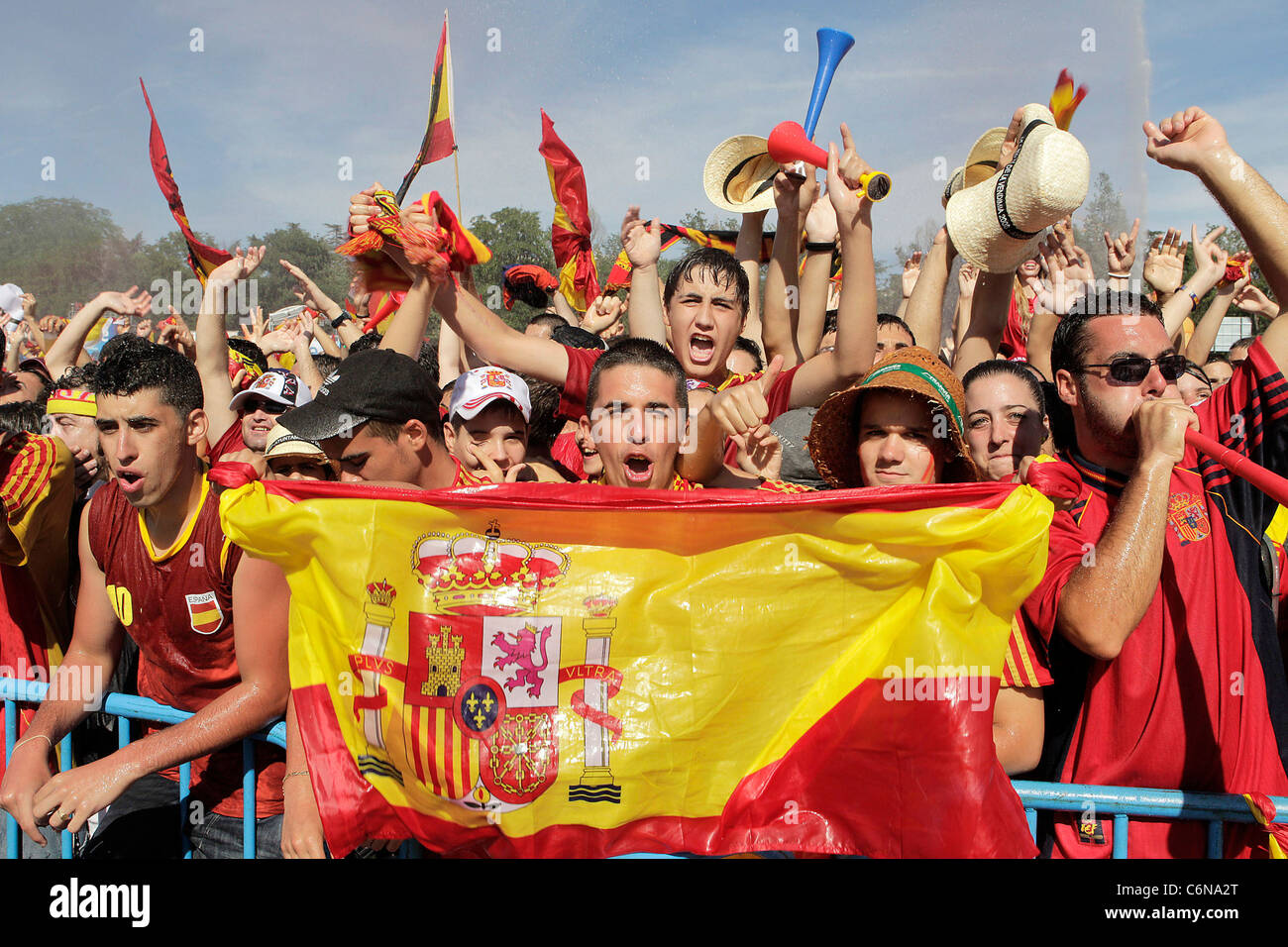 Crowds cheer for the Spanish team as they travel in an open bus as part ...