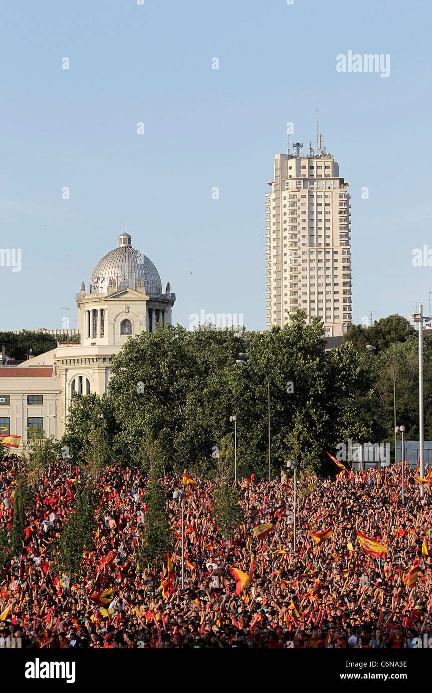 Crowds cheer as the Spanish team as they travel in an open bus as part ...