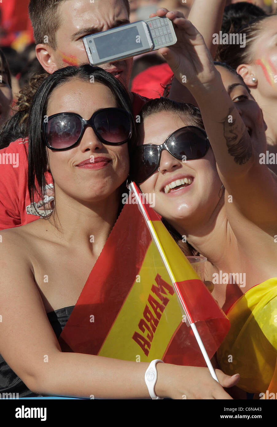 Crowds cheer for the Spanish team as they travel in an open bus as part ...