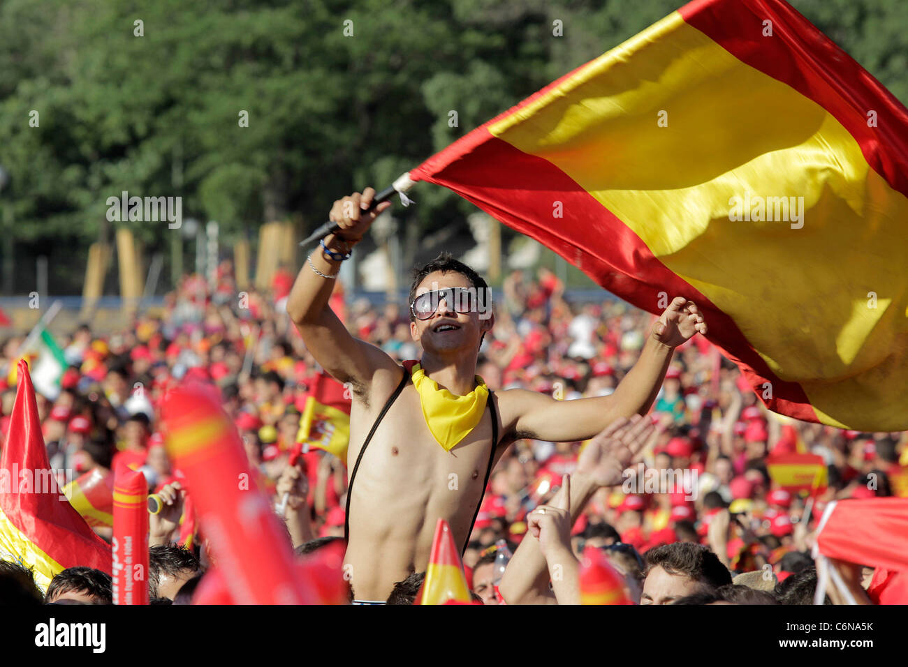 Crowds cheer for the Spanish team as they travel in an open bus as part ...
