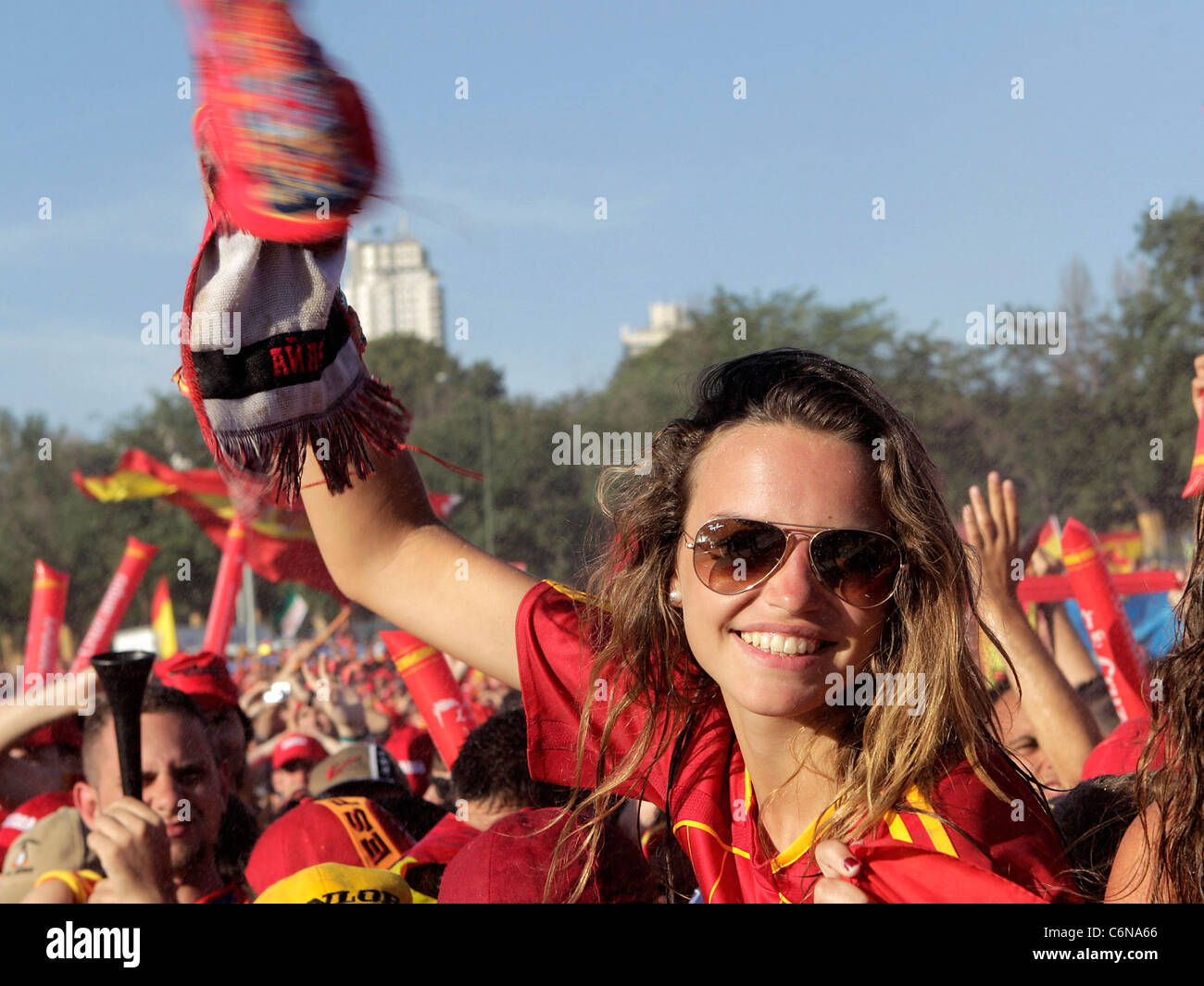 Crowds cheer for the Spanish team as they travel in an open bus as part ...