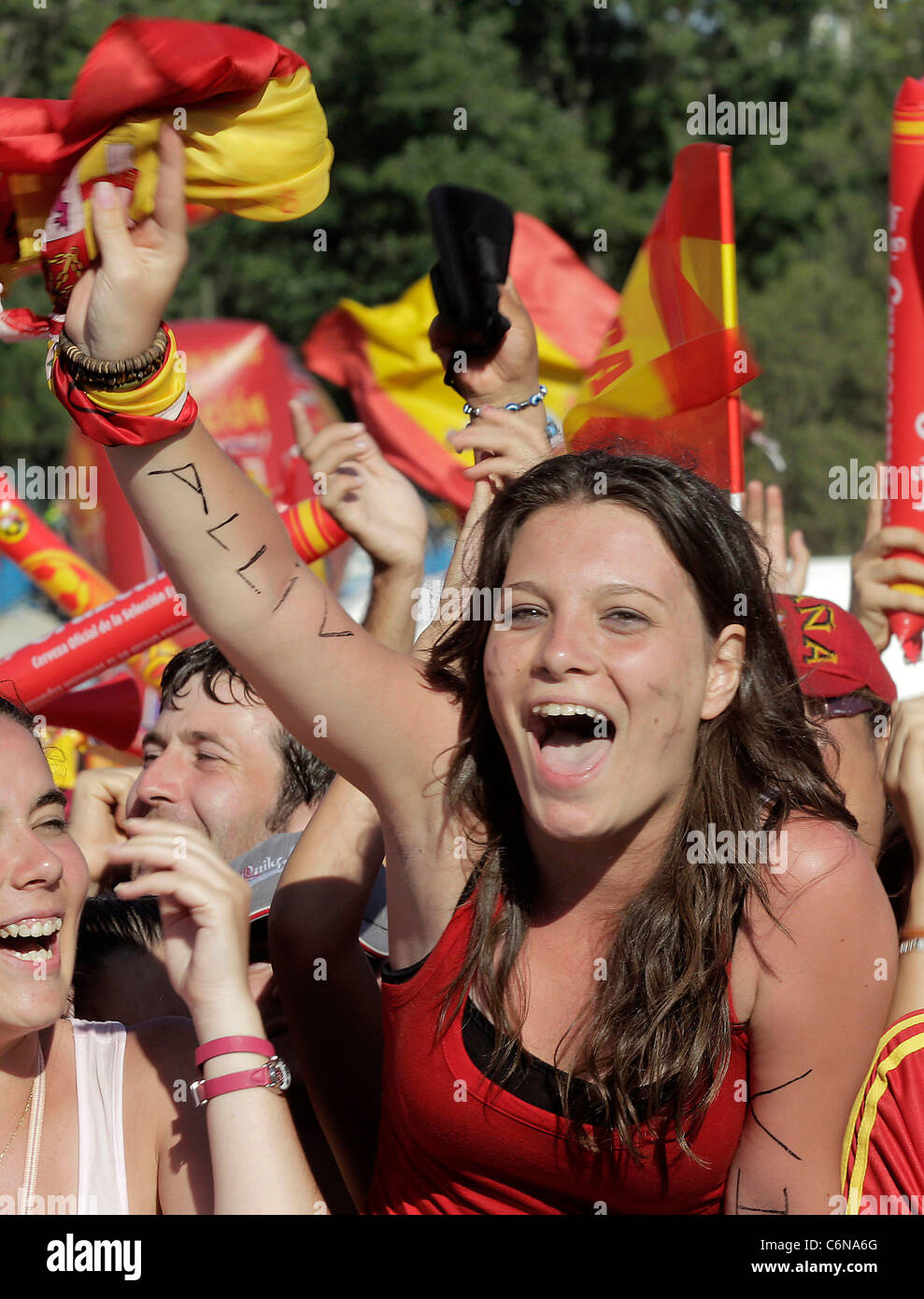 Crowds cheer for the Spanish team as they travel in an open bus as part ...