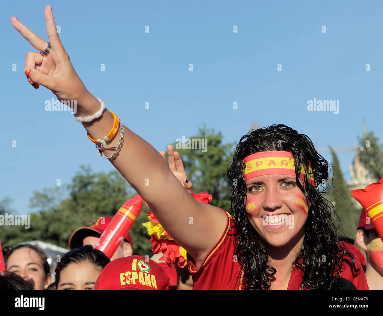 Crowds cheer for the Spanish team as they travel in an open bus as part ...
