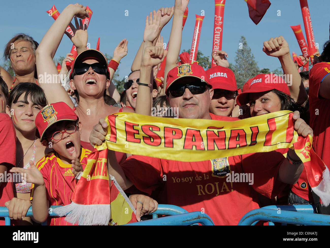 Crowds cheer for the Spanish team as they travel in an open bus as part ...