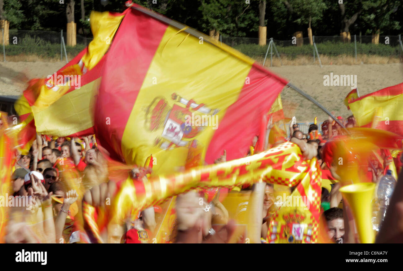 Crowds cheer for the Spanish team as they travel in an open bus as part ...