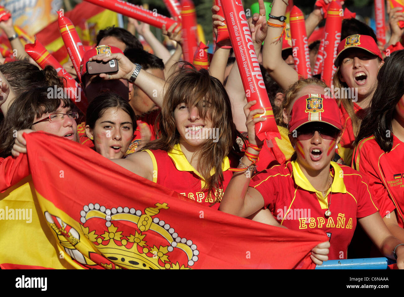 Crowds cheer for the Spanish team as they travel in an open bus as part ...