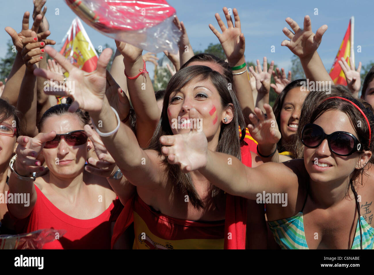Crowds cheer for the Spanish team as they travel in an open bus as part ...