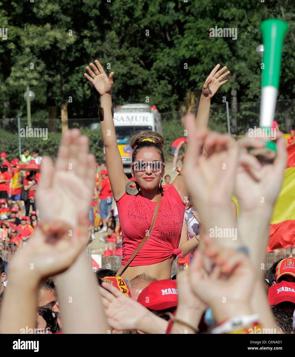 Crowds cheer for the Spanish team as they travel in an open bus as part ...