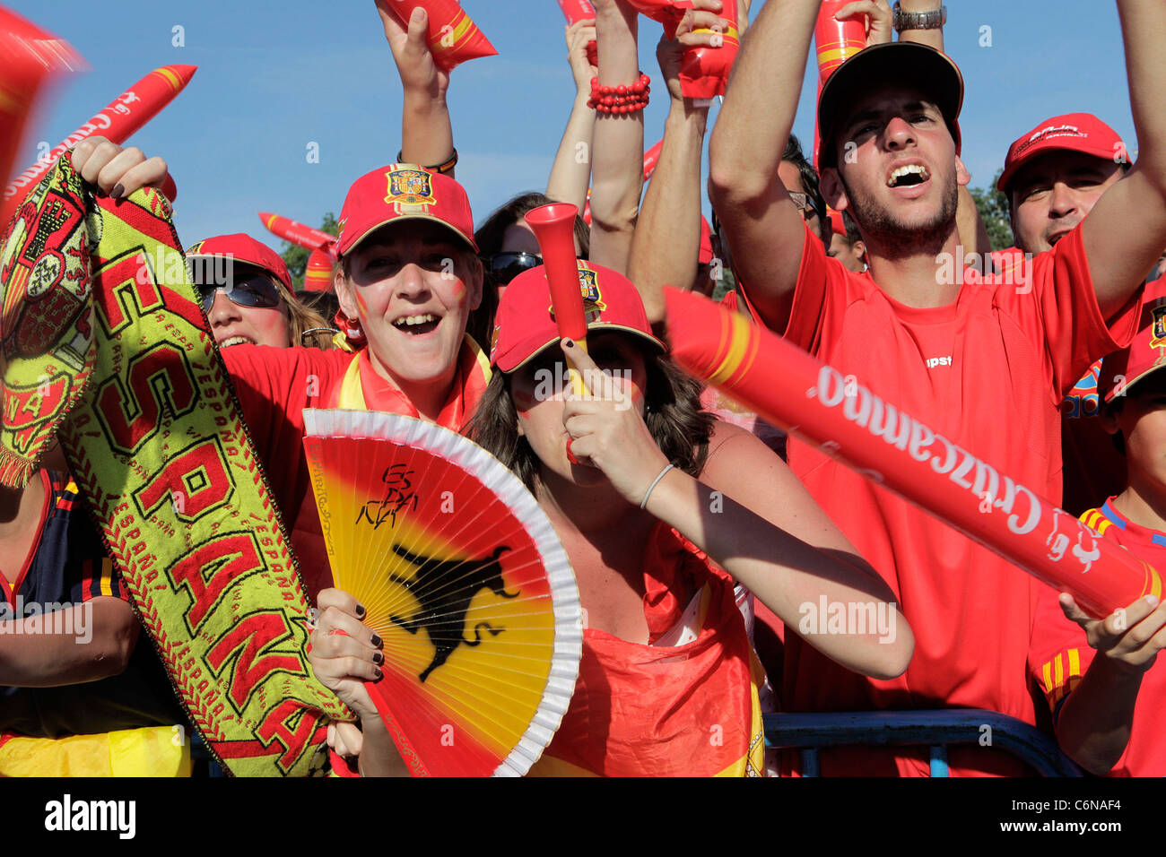 Crowds cheer for the Spanish team as they travel in an open bus as part ...