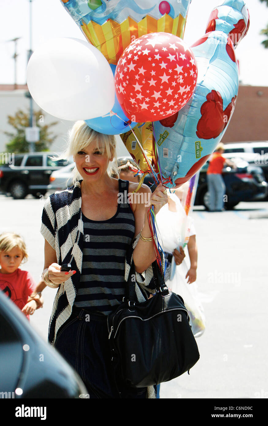 Gwen Stefani shopping at Party City in Hollywood with family holding a ...