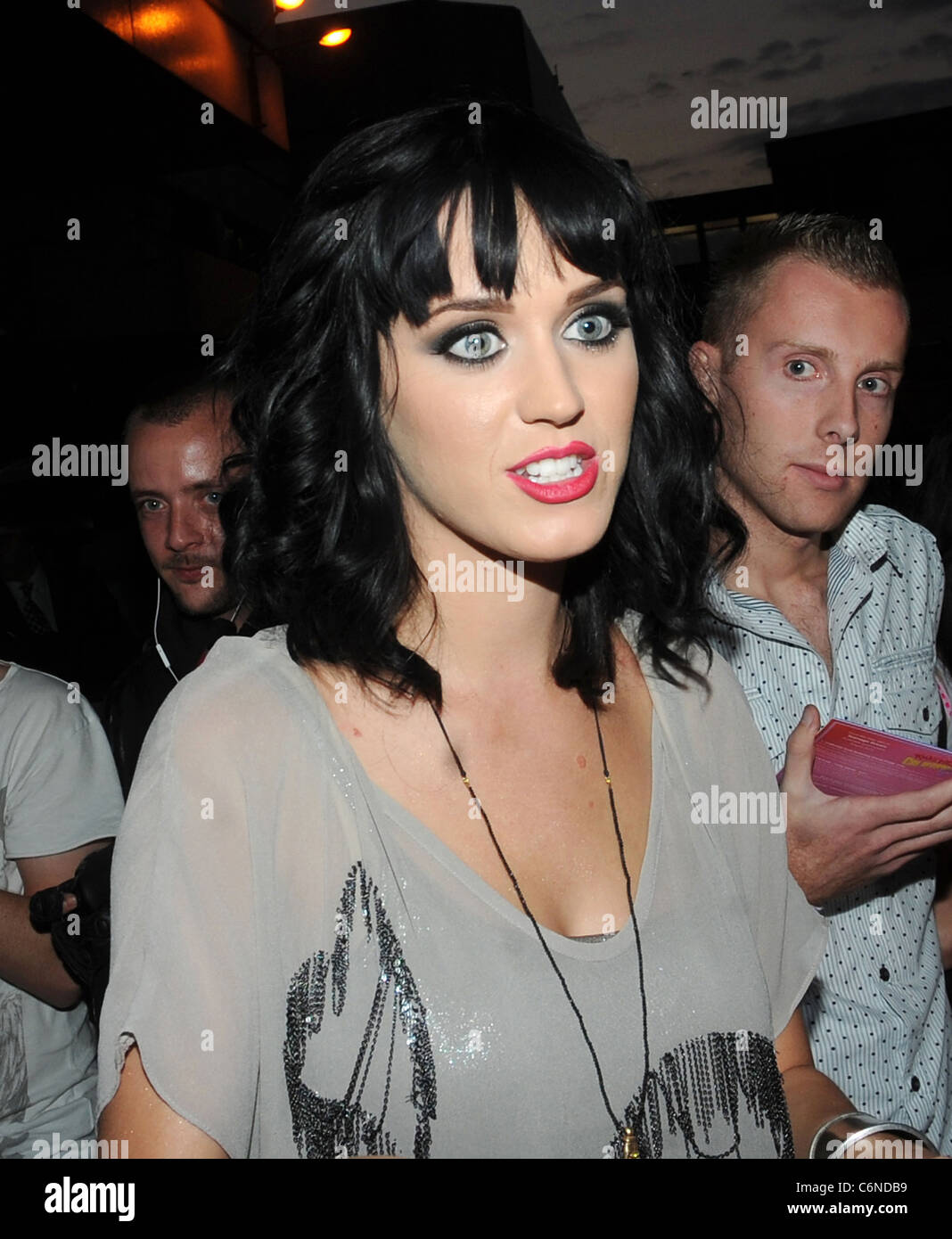 Katy Perry autographs t-shirts and poses for photographs as she is ...