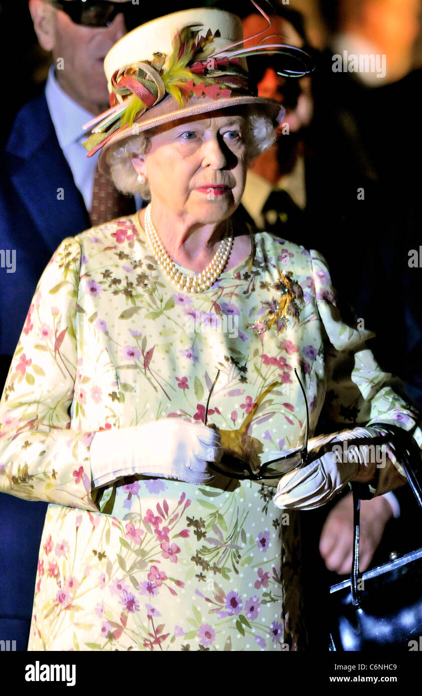 Queen Elizabeth II wears 3D spectacles as she watches a 3D display ...