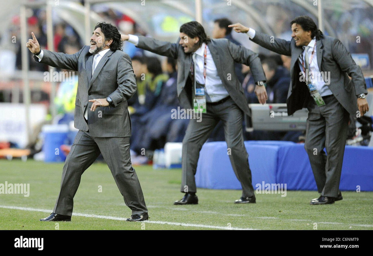 Argentina coach Diego Maradona (L) gives instructions to his players ...