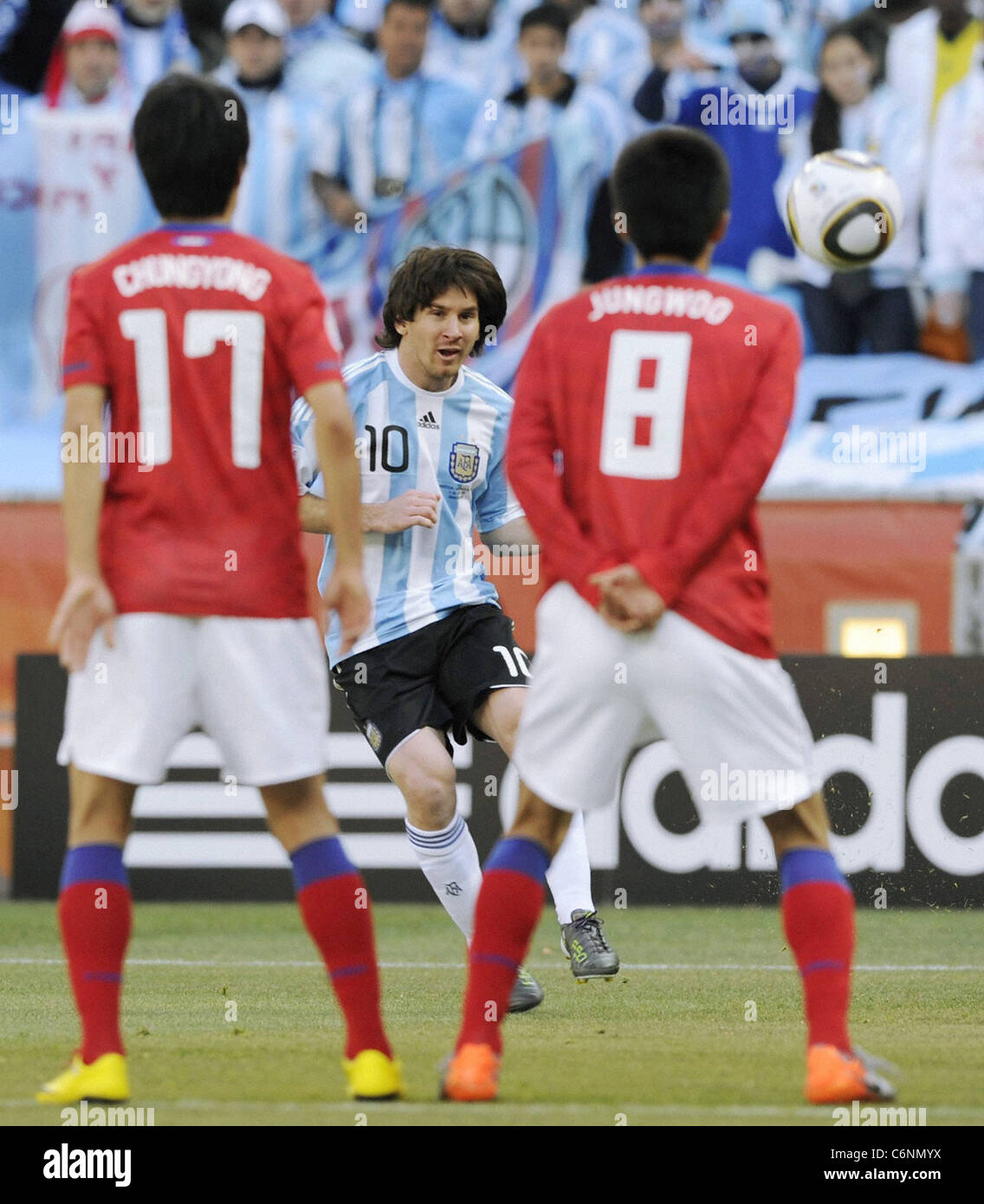 Argentina forward Lionel Messi (C) takes a free kick that led to an own ...