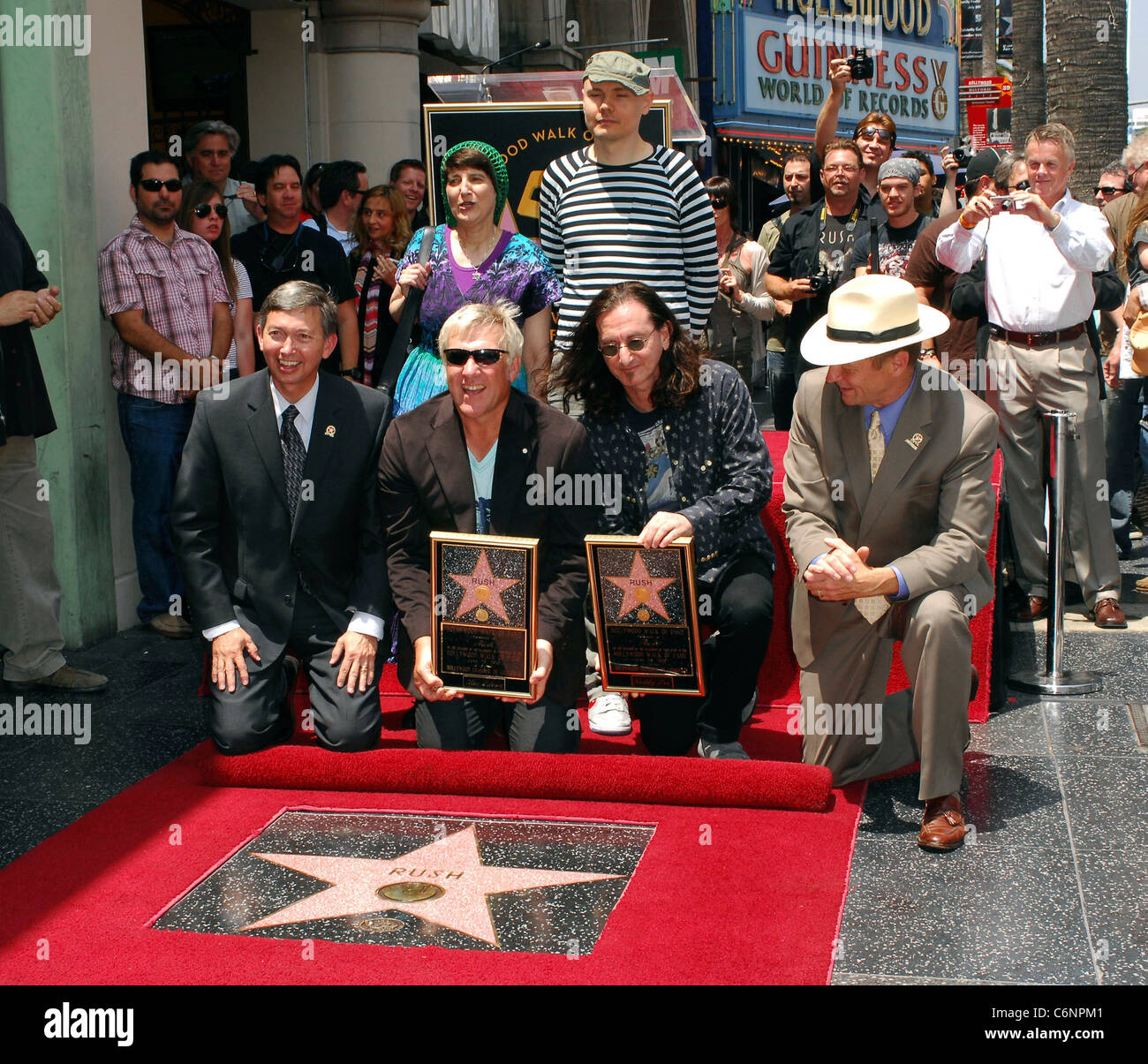 Leron Gubler, Alex Lifeson and Geddy Lee and guest Rush are honoured ...