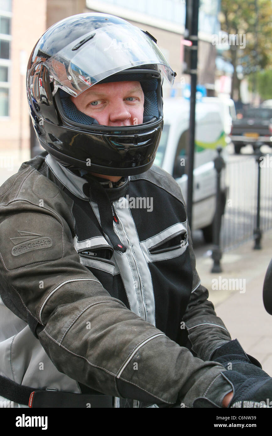 Adrian Chiles Arrives by motorcycle for a photo shoot at a studio in ...