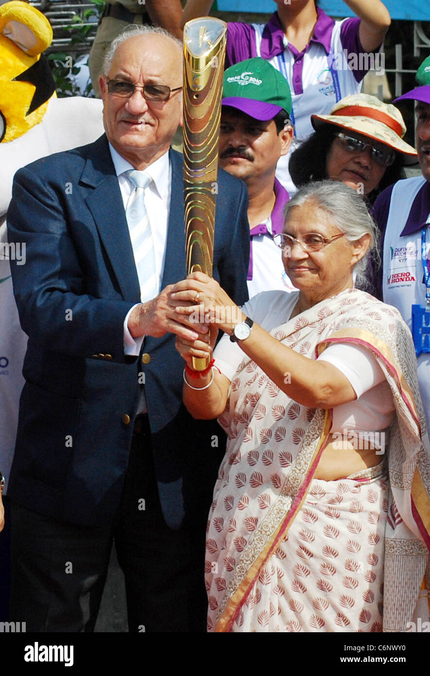 Mike Fennell, President of the Commonwealth Games Federation, hands ...