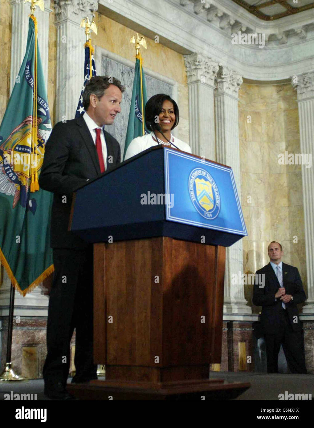 The Secretary of Treasury Timothy Geithner and Michelle Obama speaking ...
