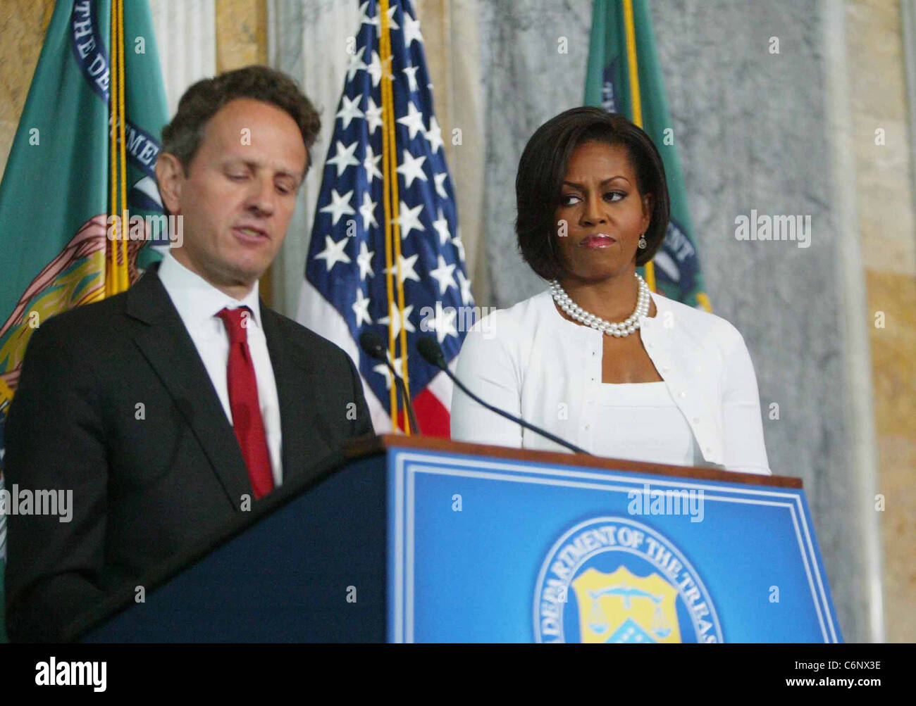 The Secretary of Treasury Timothy Geithner and Michelle Obama speaking ...