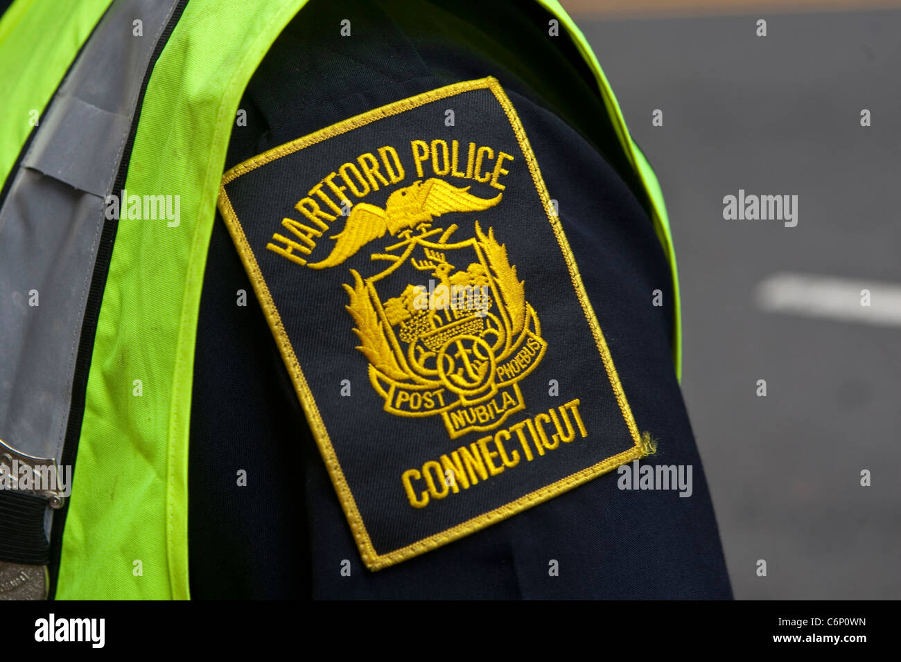 An Hartford Police badge is pictured on an officer in Hartford ...