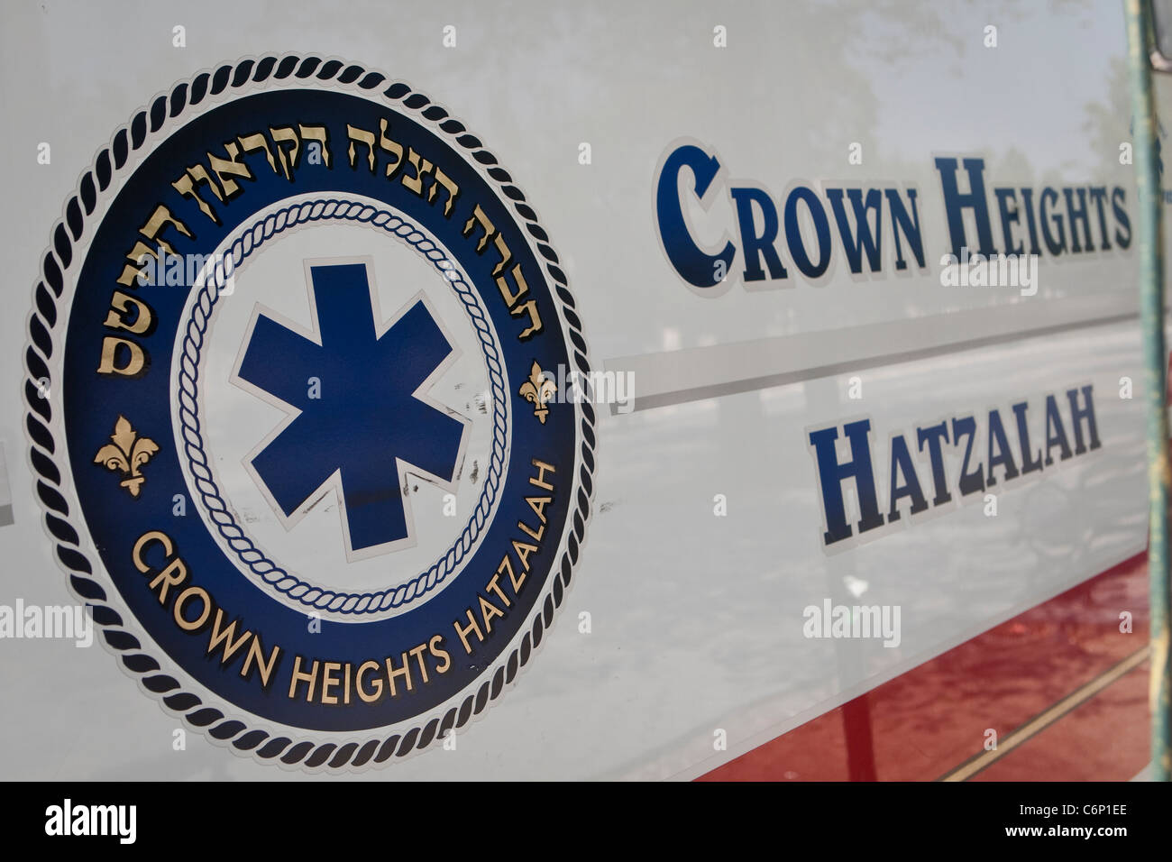 A Hatzalah ambulance is parked by the Jewish Hassidic Lubavitch ...
