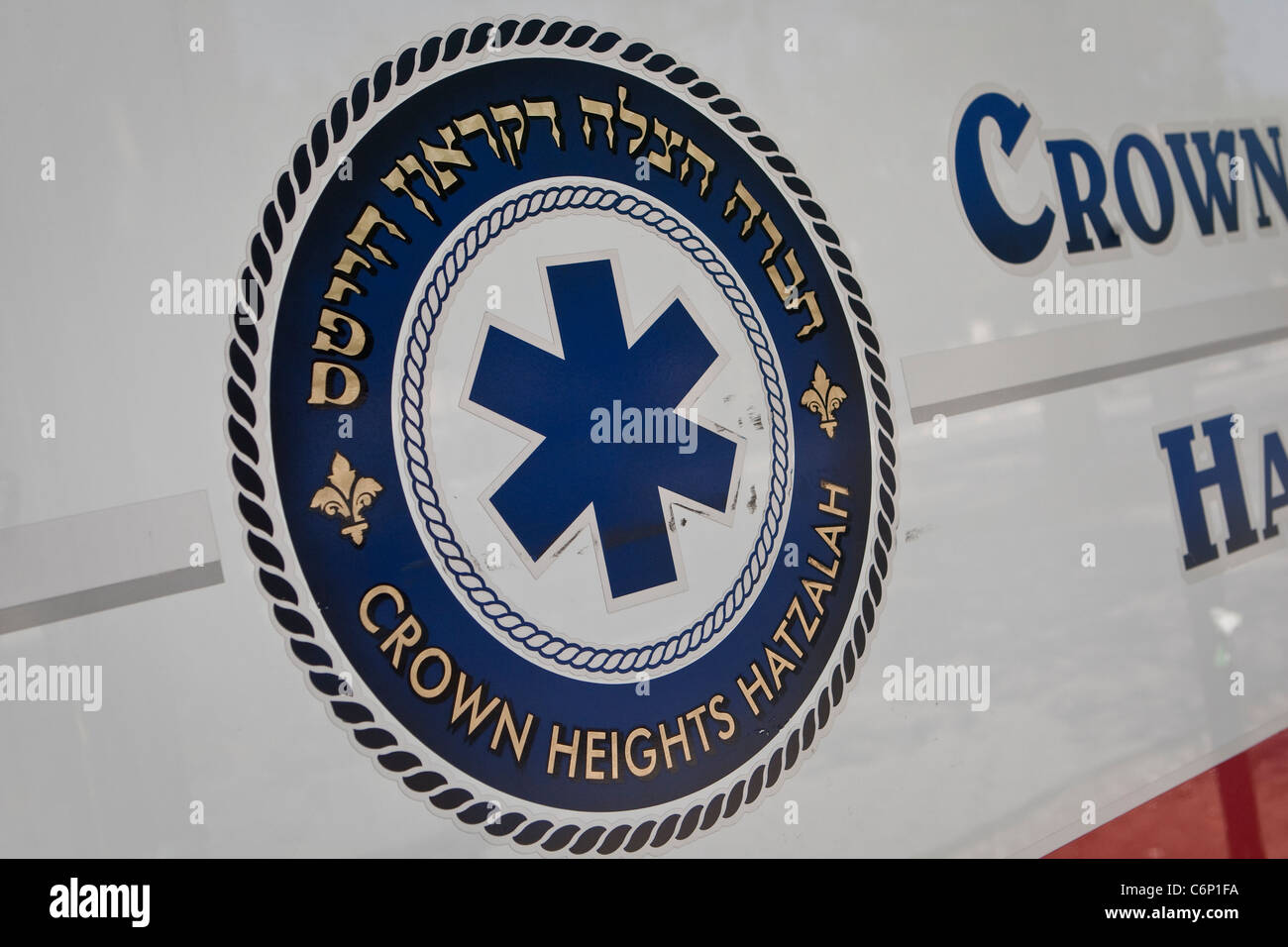 A Hatzalah ambulance is parked by the Jewish Hassidic Lubavitch ...