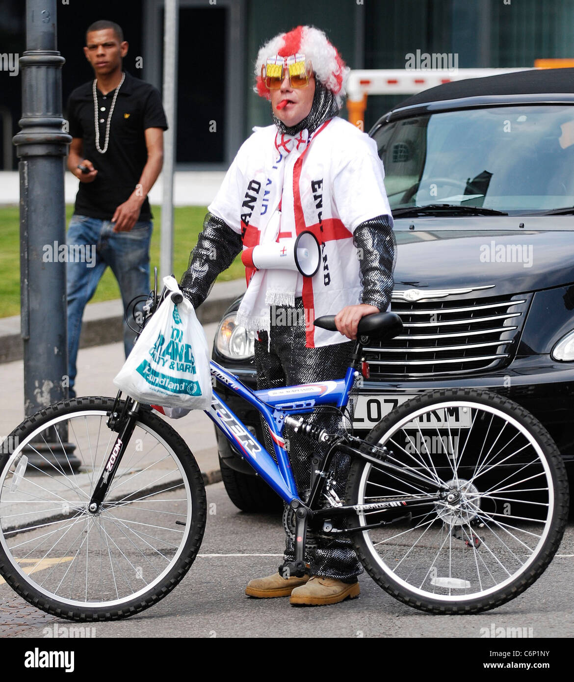 An dejected England fan watch the World Cup match against Germany at ...
