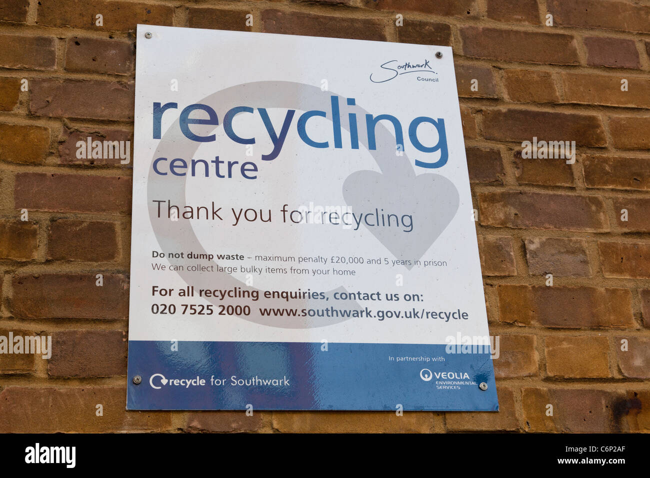 Sign on a wall outside a recycling centre, London, England Stock Photo ...