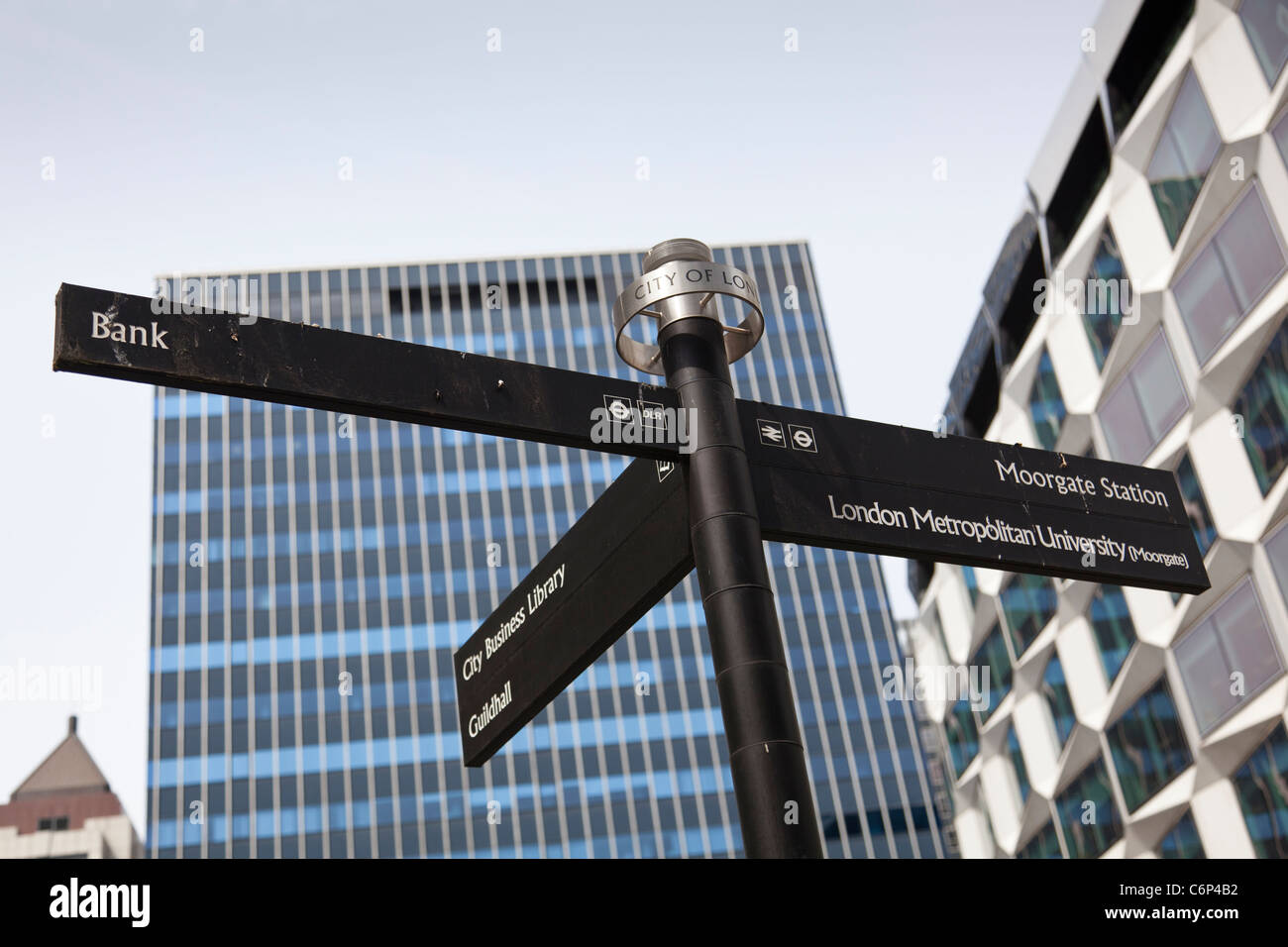 Signpost juxtaposed with high buildings, London, England Stock Photo ...