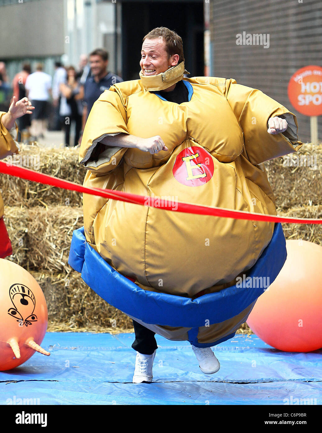 Joe Swash wearing a Sumo-wrestler costume while filming 'This Morning ...
