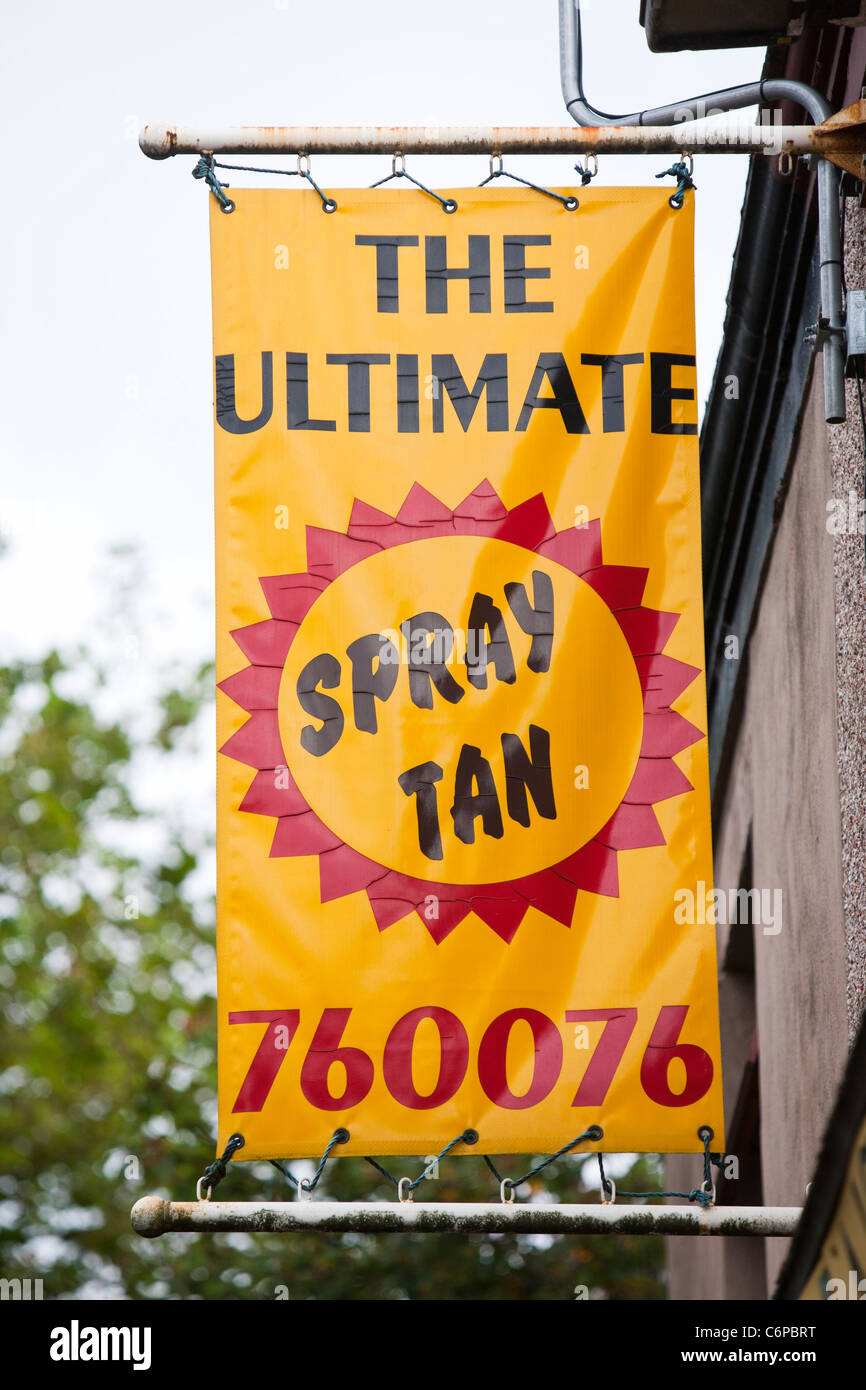 An advert for spray tanning in Preston, Lancashire, UK Stock Photo - Alamy