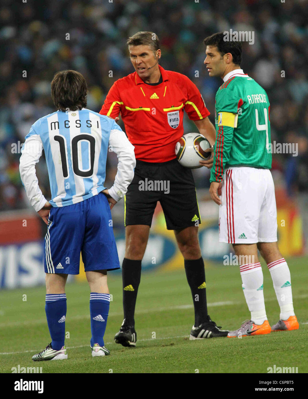 Referee Roberto Rosetti with Messi and Marquez 2010 FIFA World Cup ...