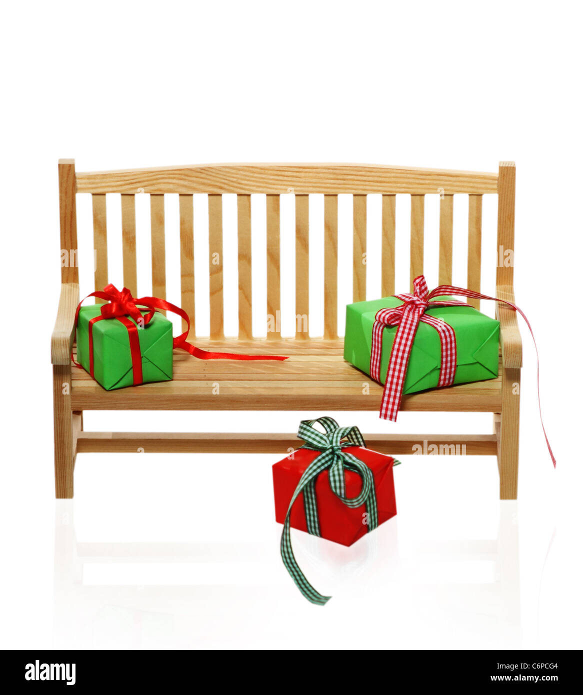 Christmas wooden bench with presents over white Stock Photo - Alamy