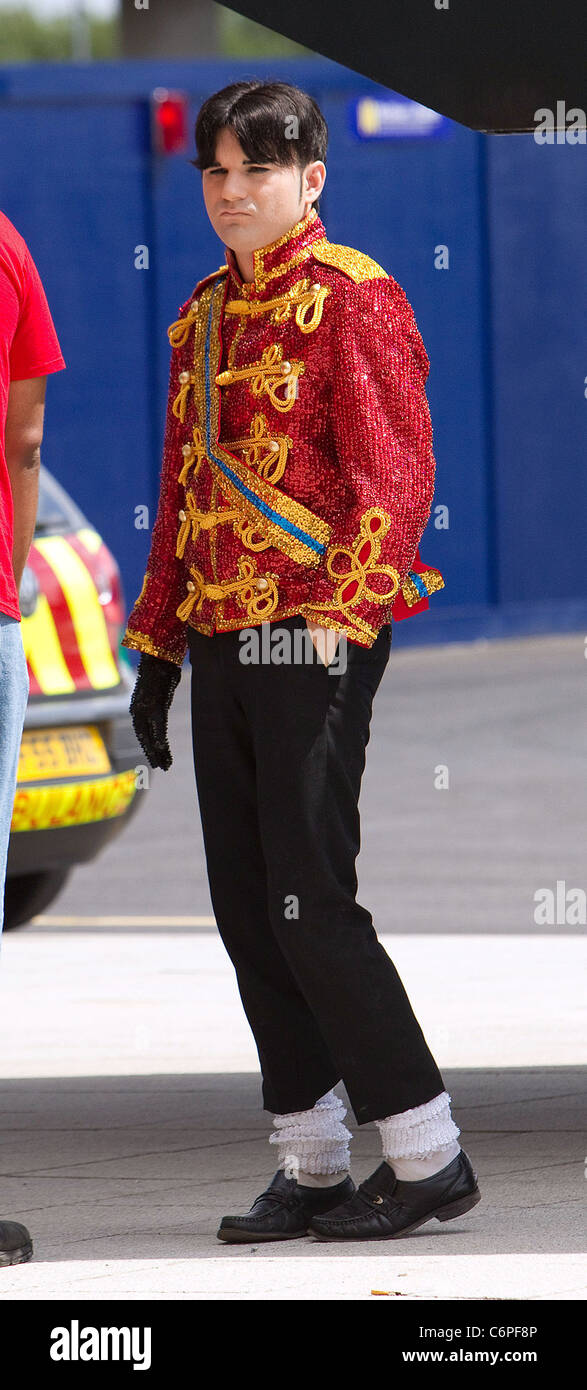 An auditionee in a Sgt. Pepper jacket outside the 'X Factor' auditions ...
