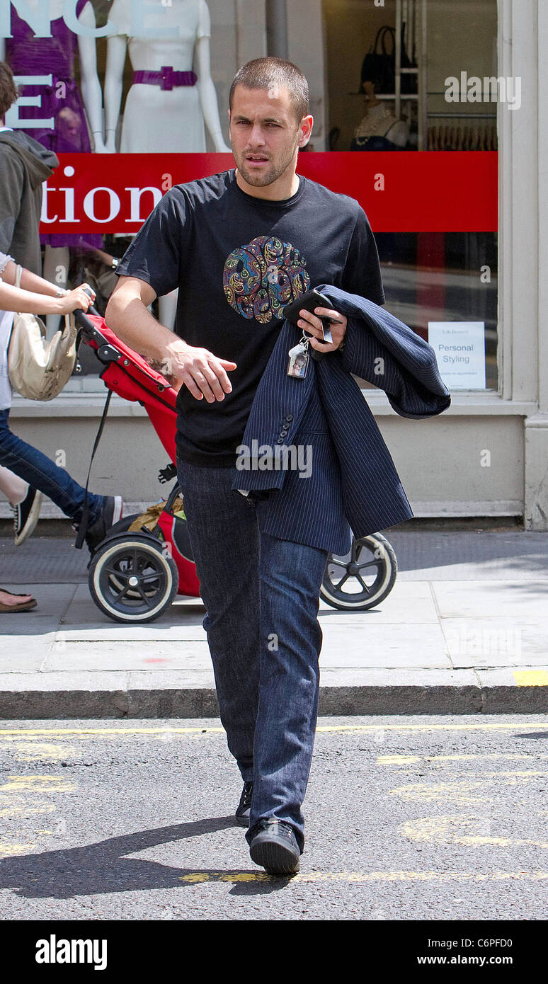 Joe Cole near his London home holding a keyring featuring a picture of ...